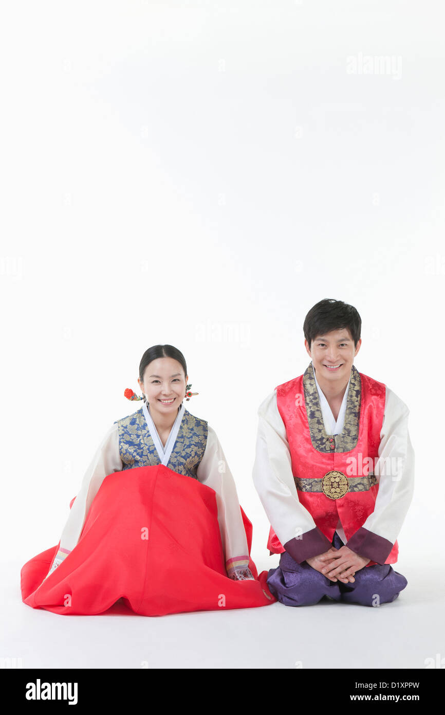 a couple sitting on the floor in Hanbok Stock Photo - Alamy
