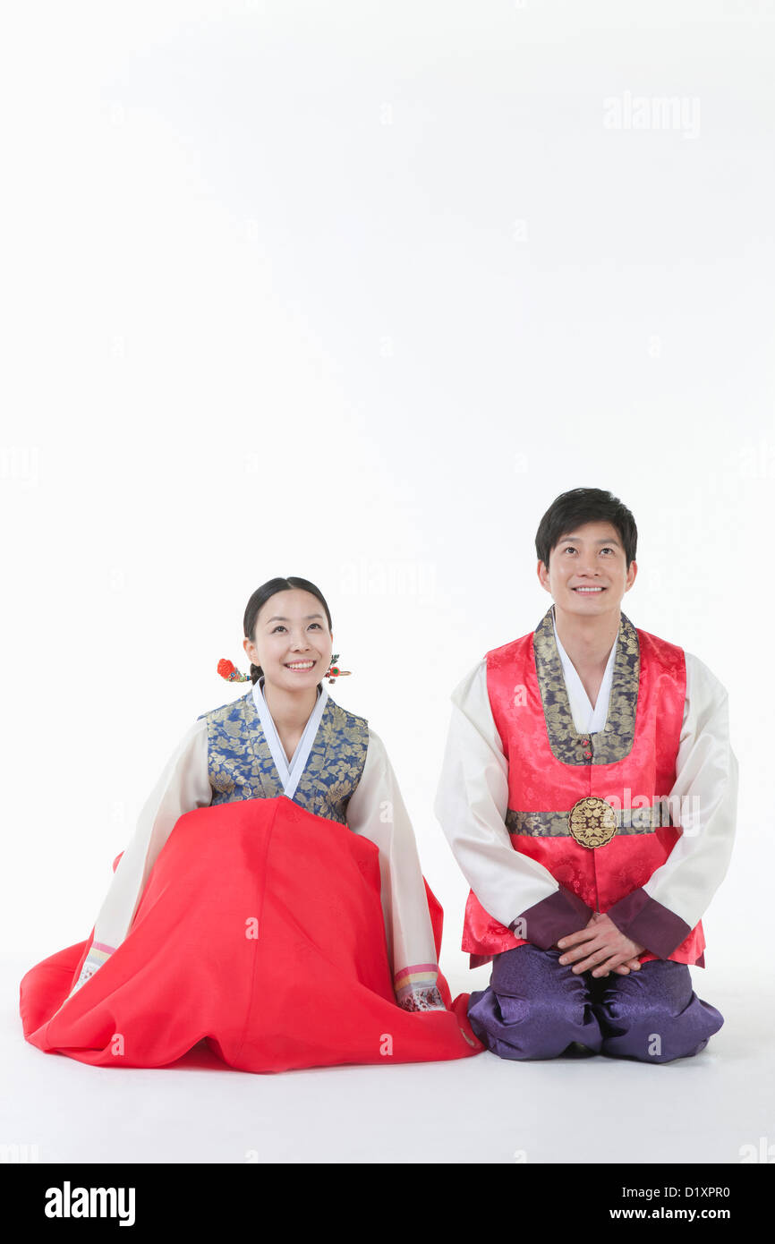 a couple sitting on the floor in Hanbok Stock Photo - Alamy