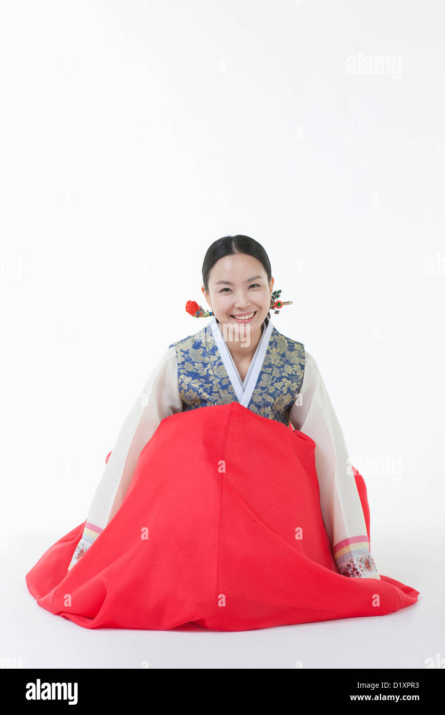 a woman sitting on the floor in Hanbok Stock Photo - Alamy