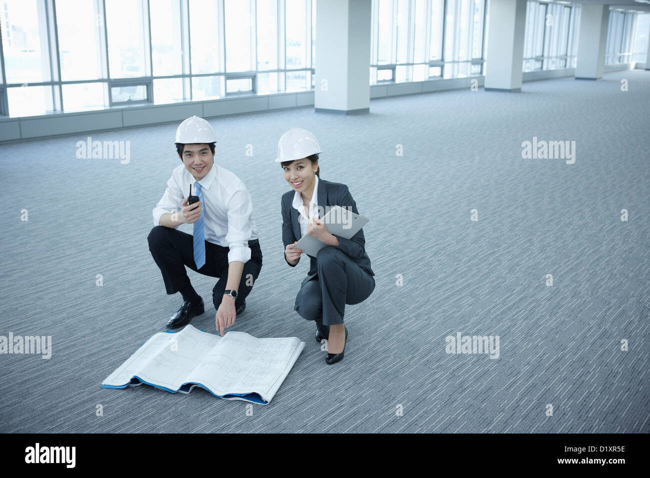 architect executives posing at camera in an empty room Stock Photo - Alamy