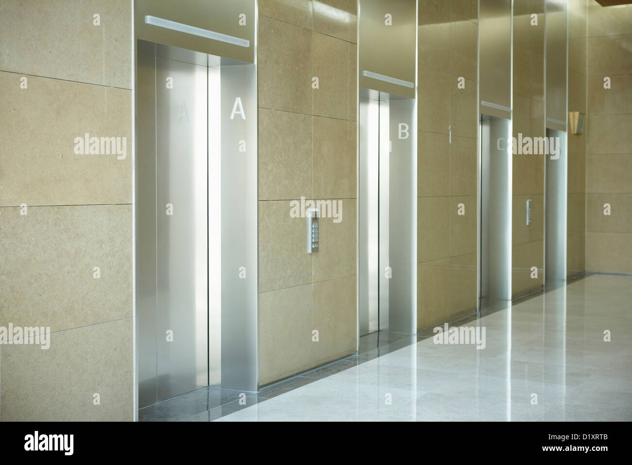 elevators in a office building Stock Photo - Alamy