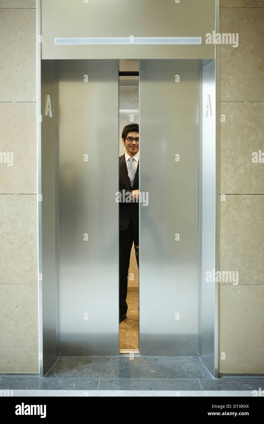 a businessman inside a closing elevator Stock Photo - Alamy a businessman inside a closing elevator Stock Photo - Alamy
