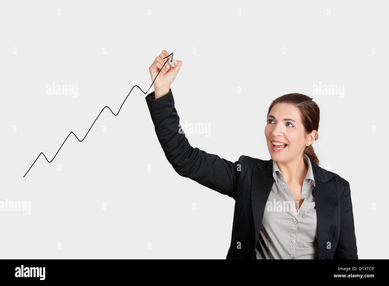 Beautiful woman drawing a chart with a recent ascent of the company ...