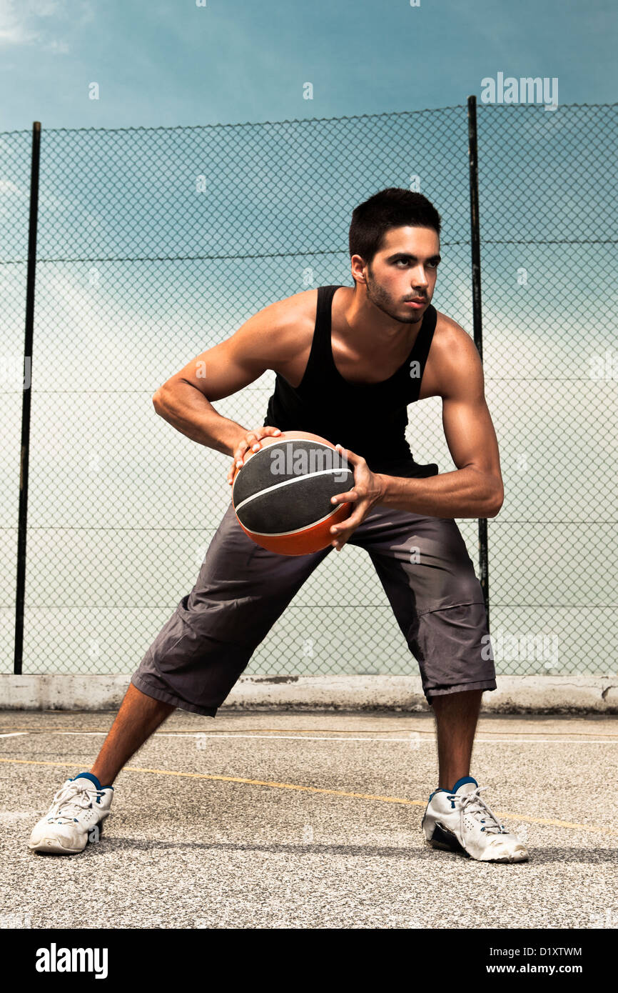 Portrait of young man street basket player Stock Photo - Alamy
