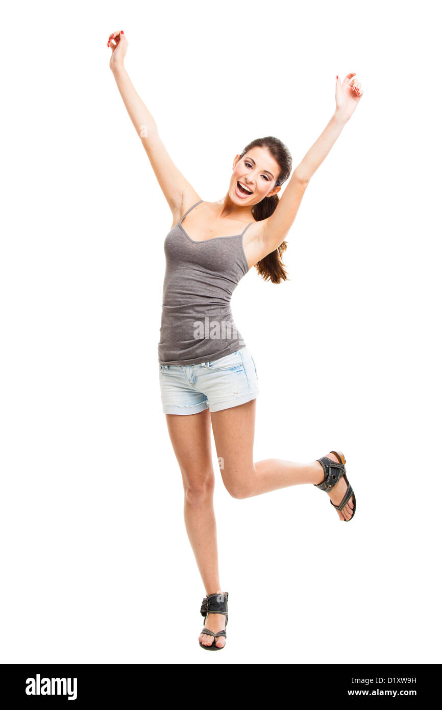 Portrait of a beautiful and happy young woman with arms raised ...