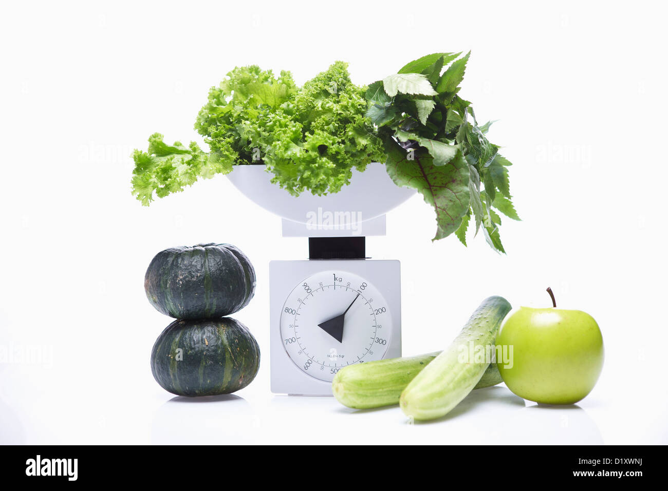 vegetables on a measuring scale Stock Photo - Alamy