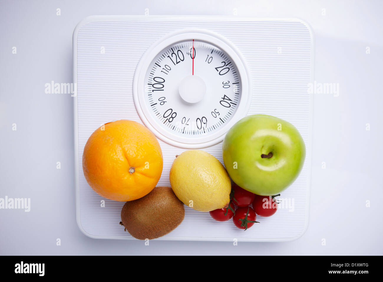 fruits on a weight scale Stock Photo - Alamy