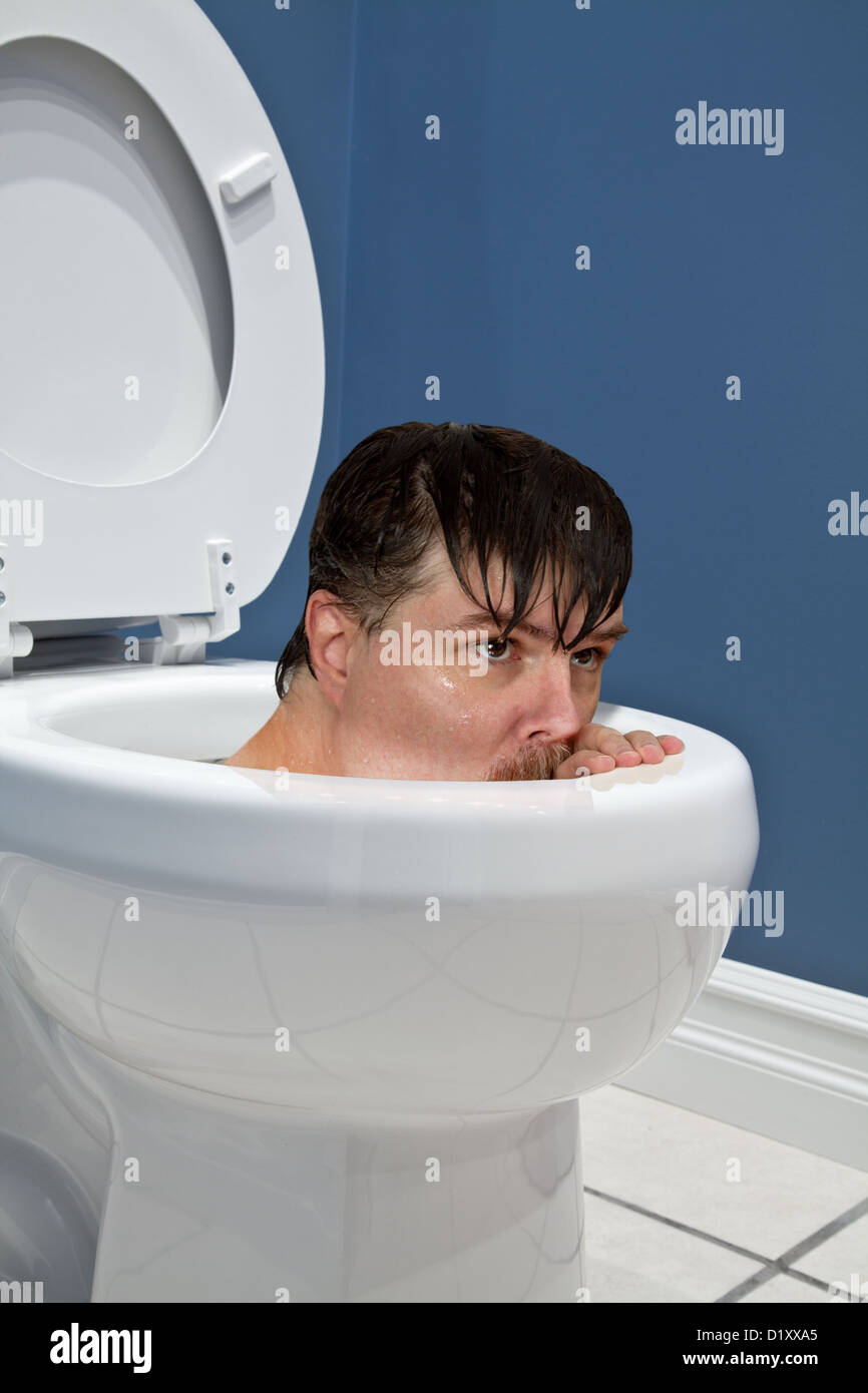 Man flushed toilet hi-res stock photography and images - Alamy