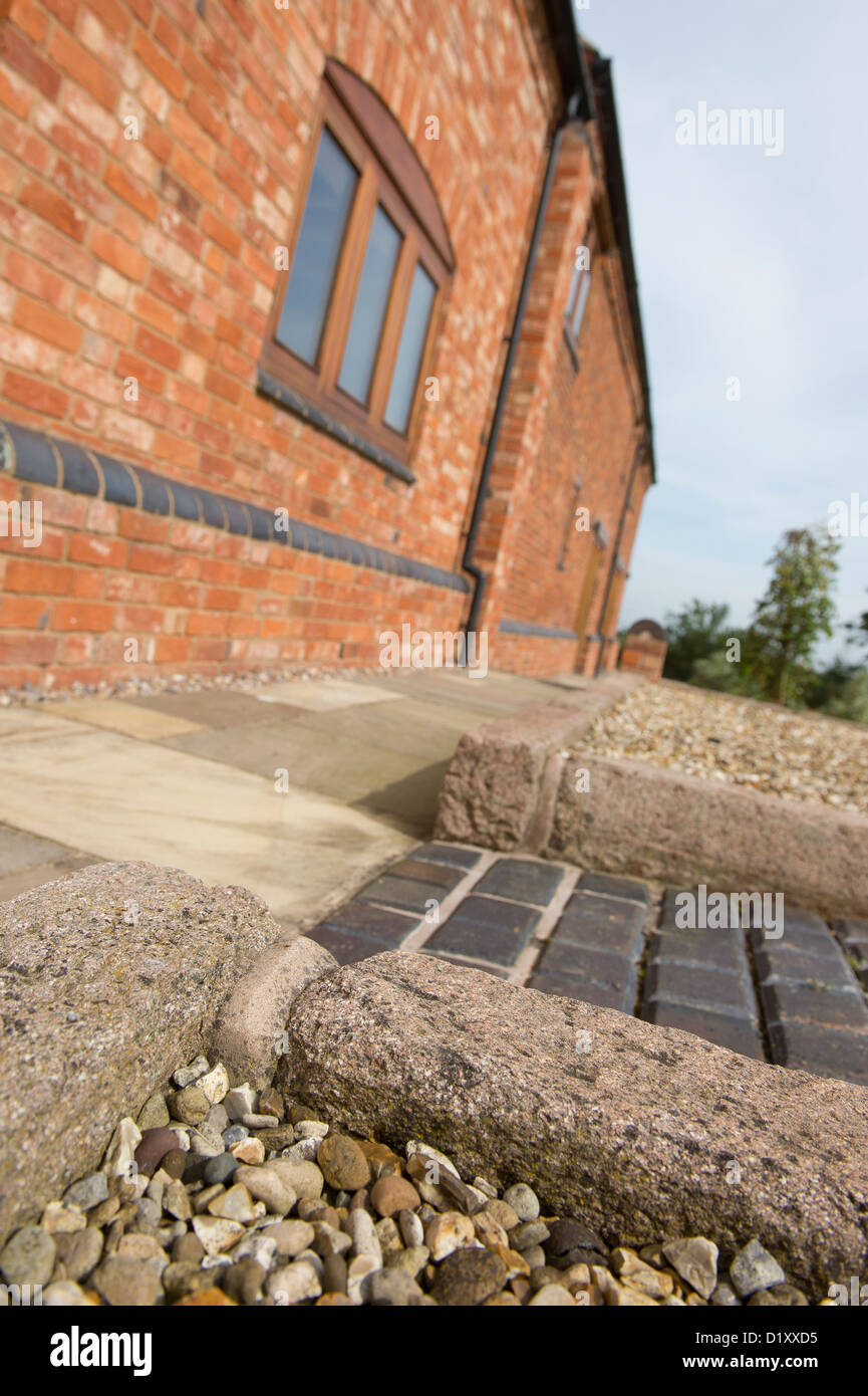 Close up exterior shot of newly laid path outside a smart barn ...