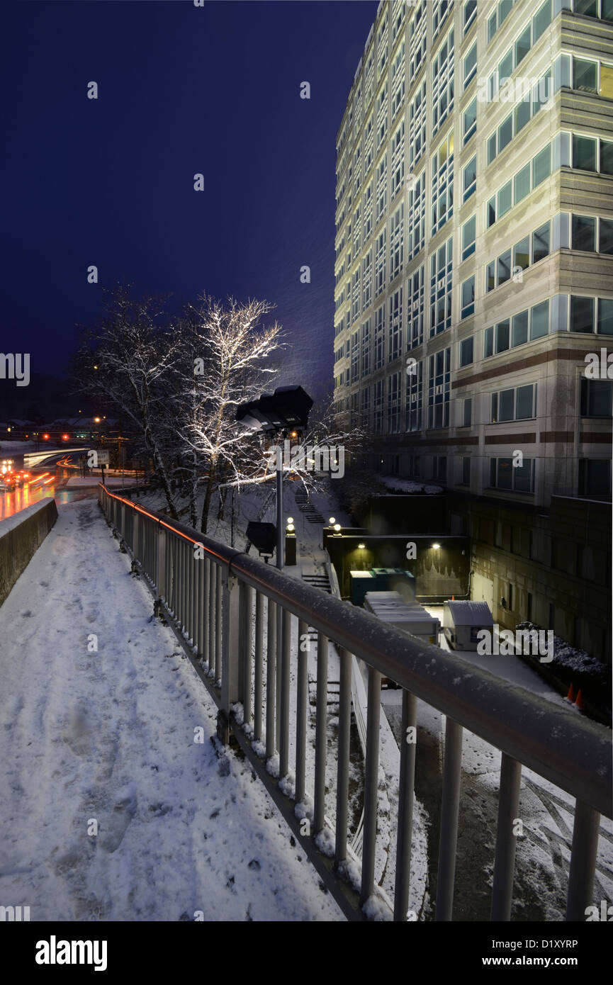 Office Building & Sidewalk In Snowy Winter Storm At Night Stock Photo ...