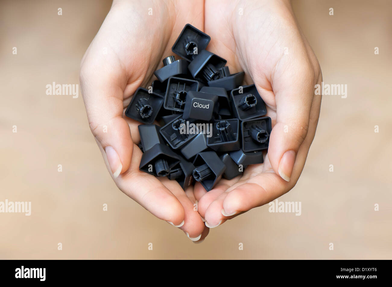 Keyboard keys in woman's hands with a "Cloud" key in the center, cloud ...