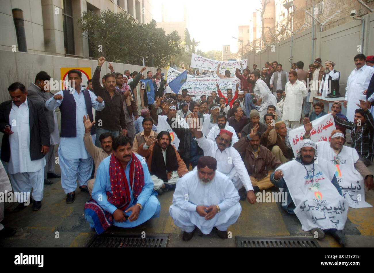 Employees of Sui Southern Gas Company chant slogans for confirmation of ...