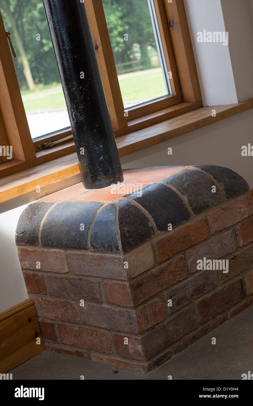 Period cast iron beam being used to support a wooden ceiling beam in a ...