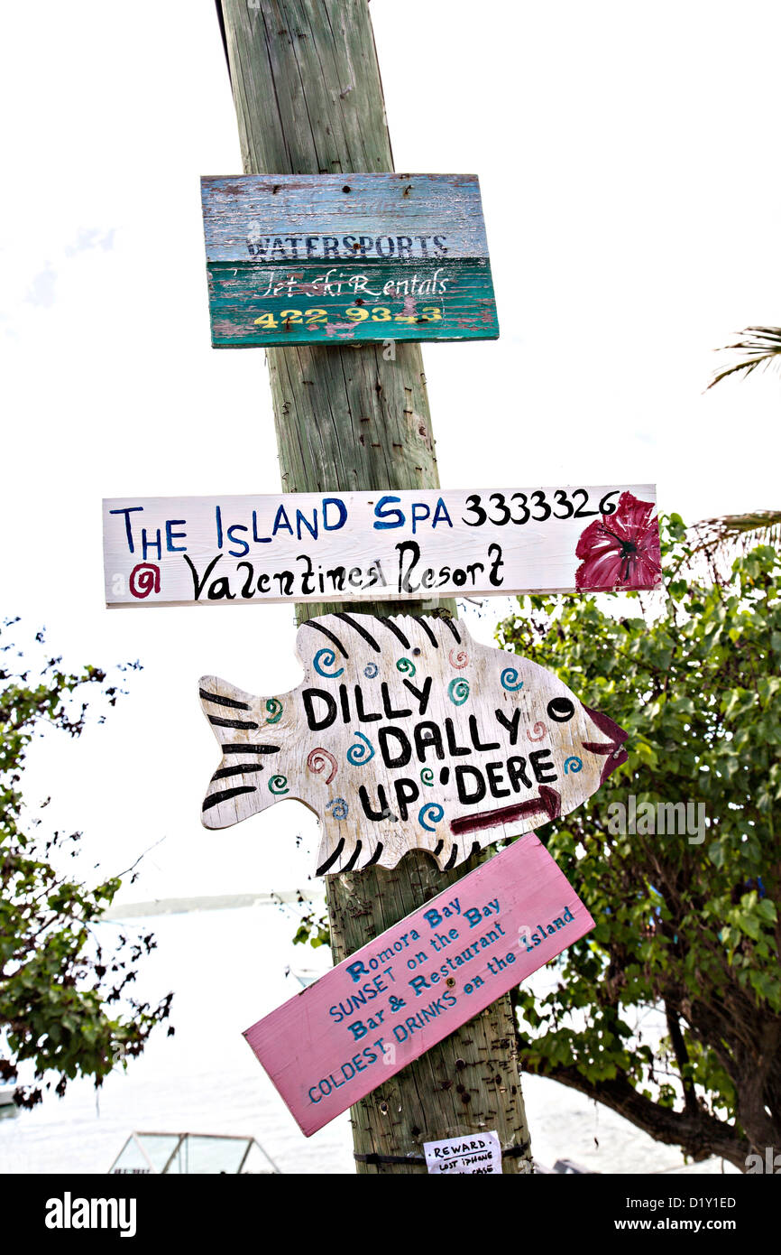 Directional signs on a telephone pole in Dunmore Town, Harbour Island ...