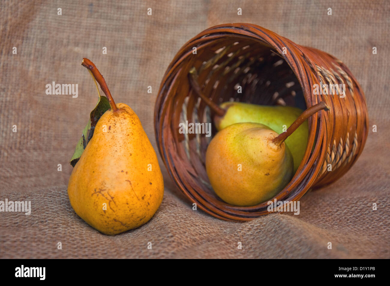 Tasty fresh ripe pear and a punnet on a table Stock Photo - Alamy