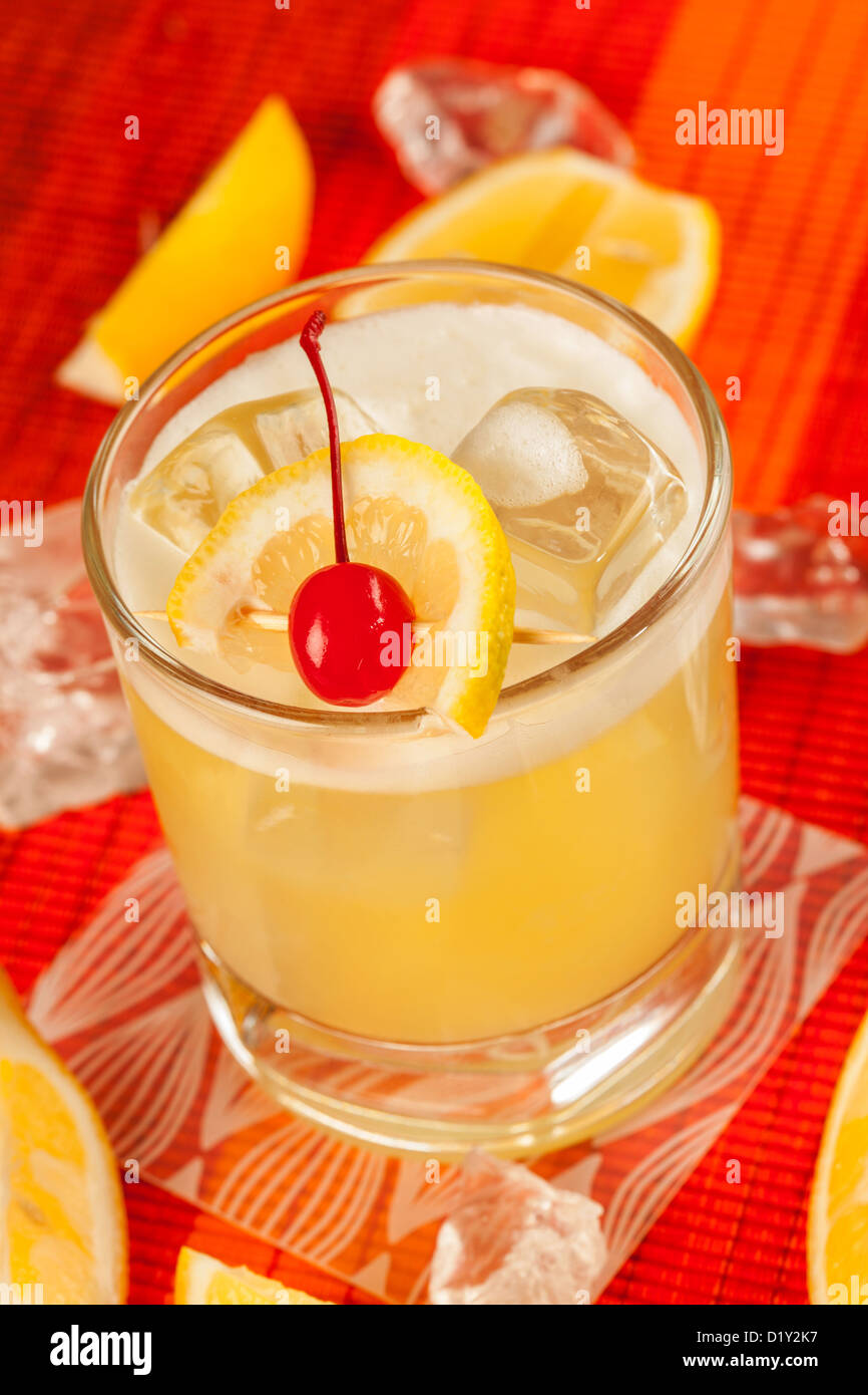 Yellow drink and ice Stock Photo - Alamy