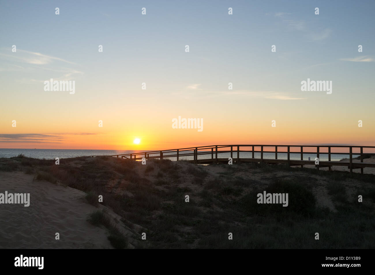 Idyllic sunrise over coastal dunes at Arenales beach, Costa Blanca ...