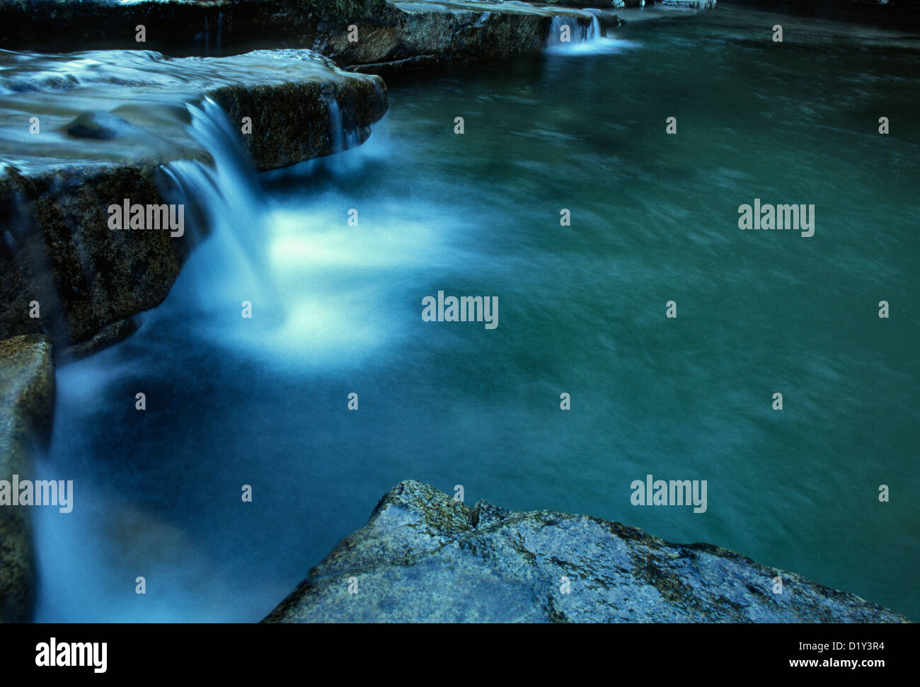 Water falling over rocks Stock Photo - Alamy