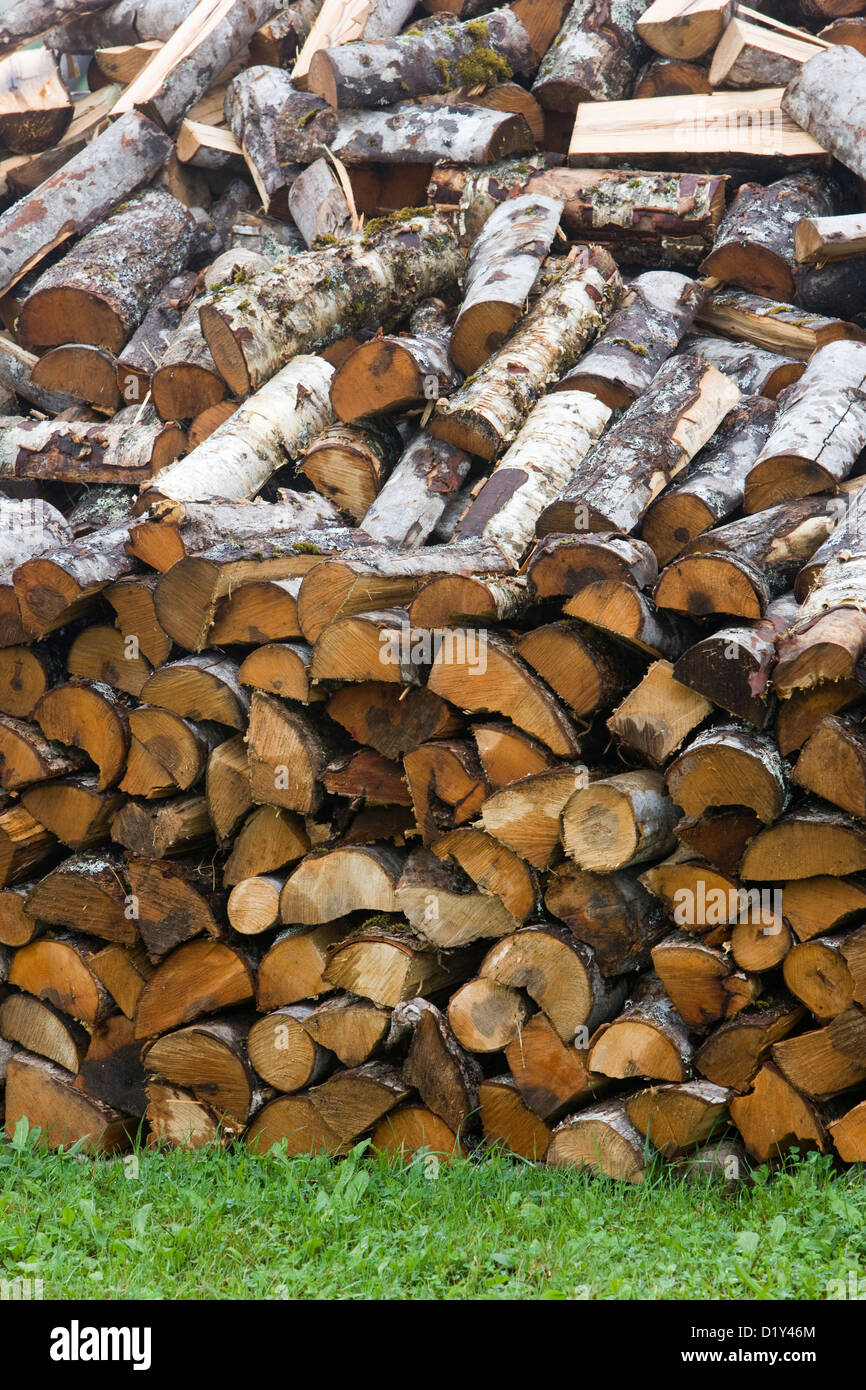 Firewood wood pile with logs chopped ready for the fire or wood burner ...