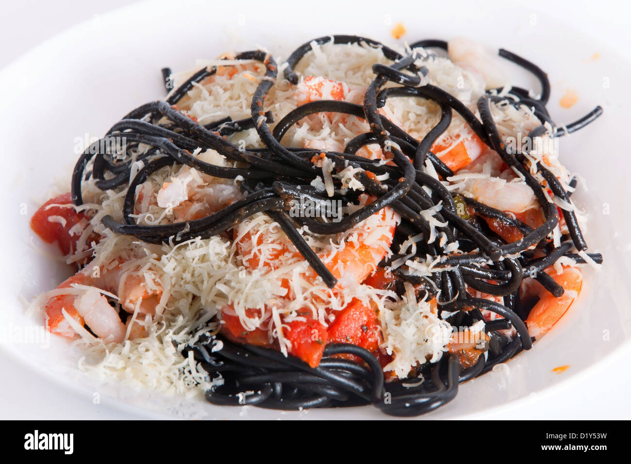 Black cuttlefish spaghetti with tomato sauce and parmesan cheese Stock ...