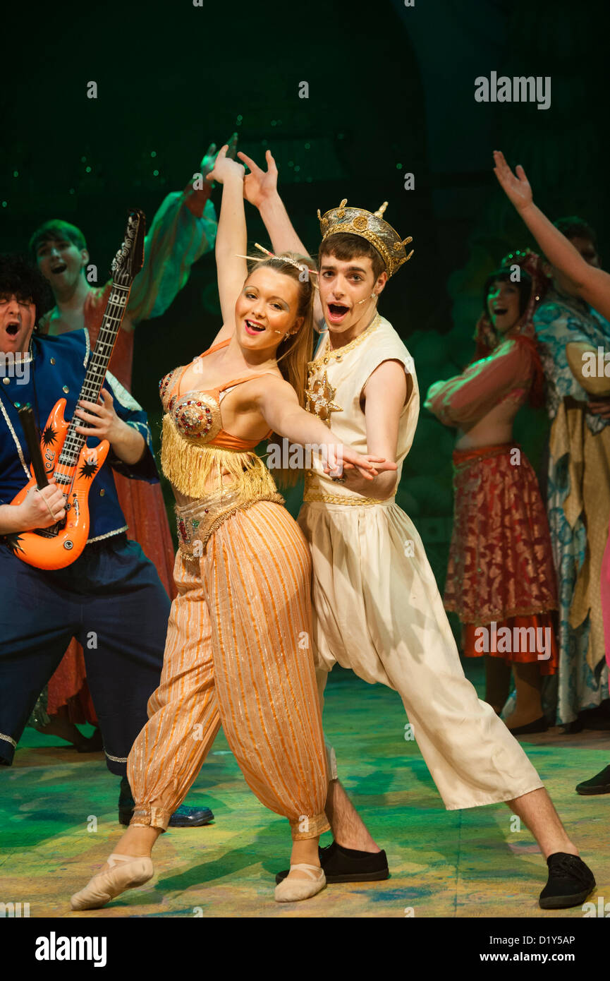 Young actors in costume performing on stage in the traditional ...