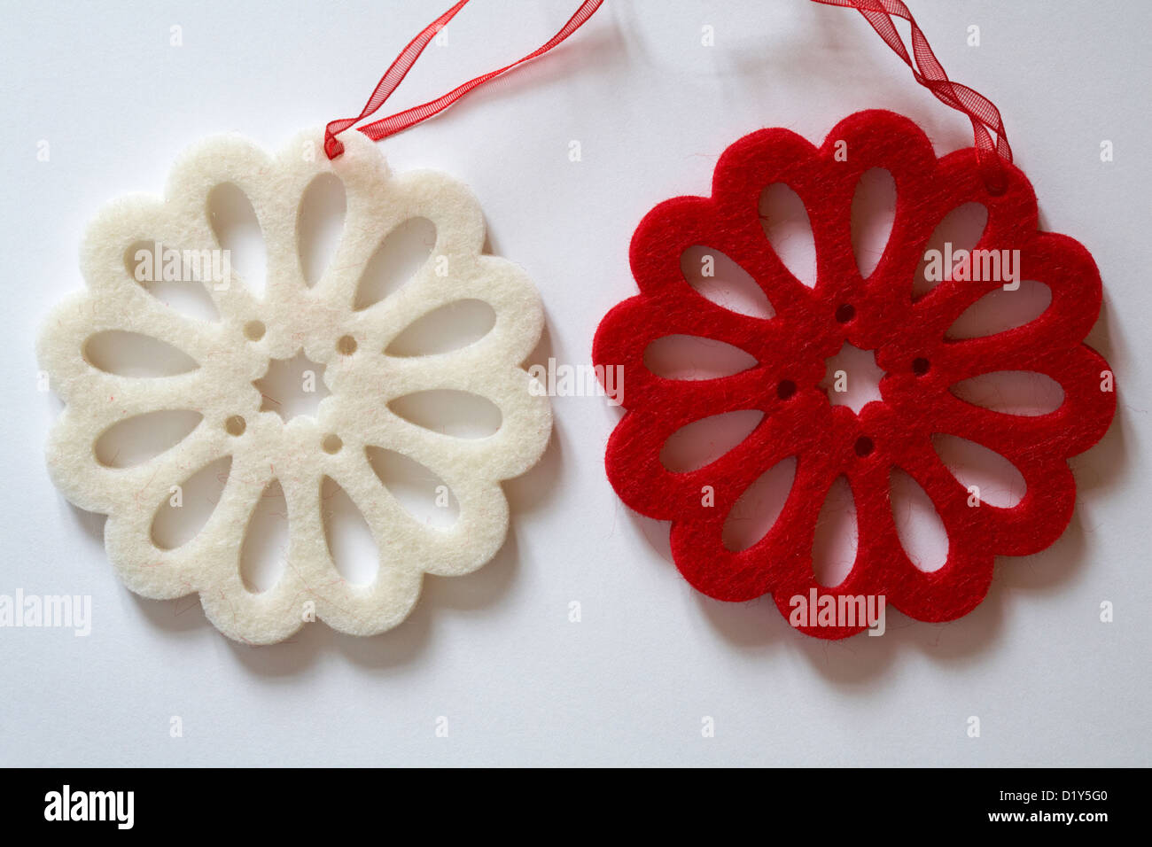red and white felt hanging snowflakes decoration set on white ...
