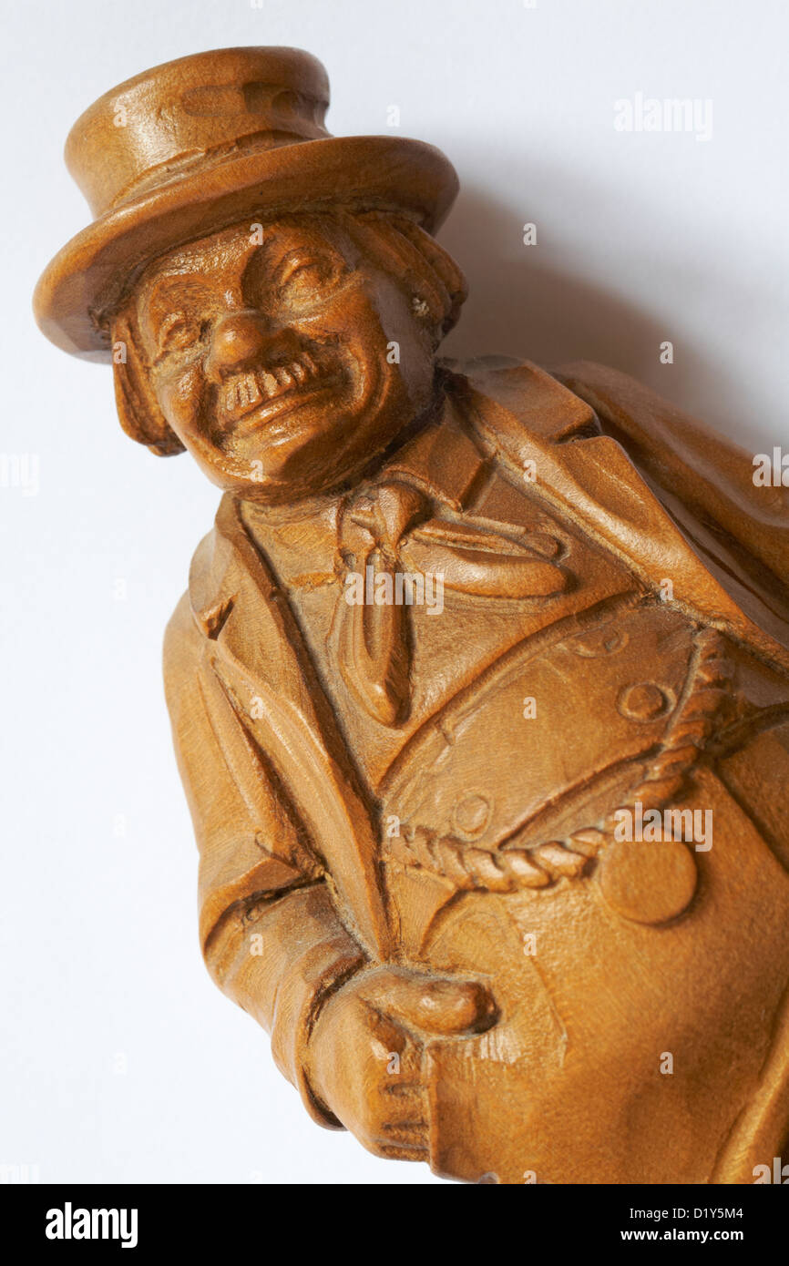 Wood carving of a jolly old fellow set on white background Stock Photo ...