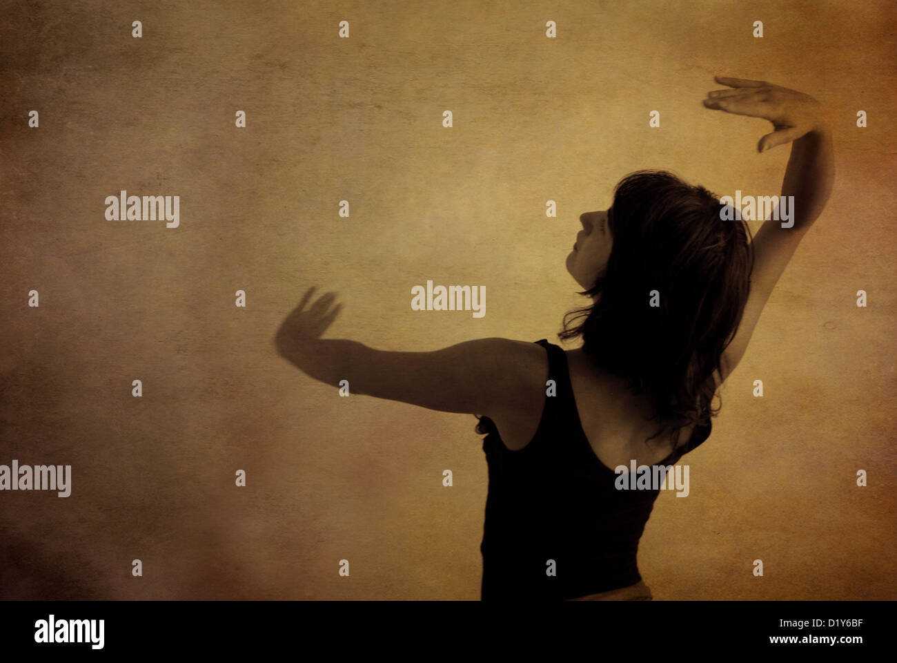 Woman dancing with her arms wide open Stock Photo - Alamy