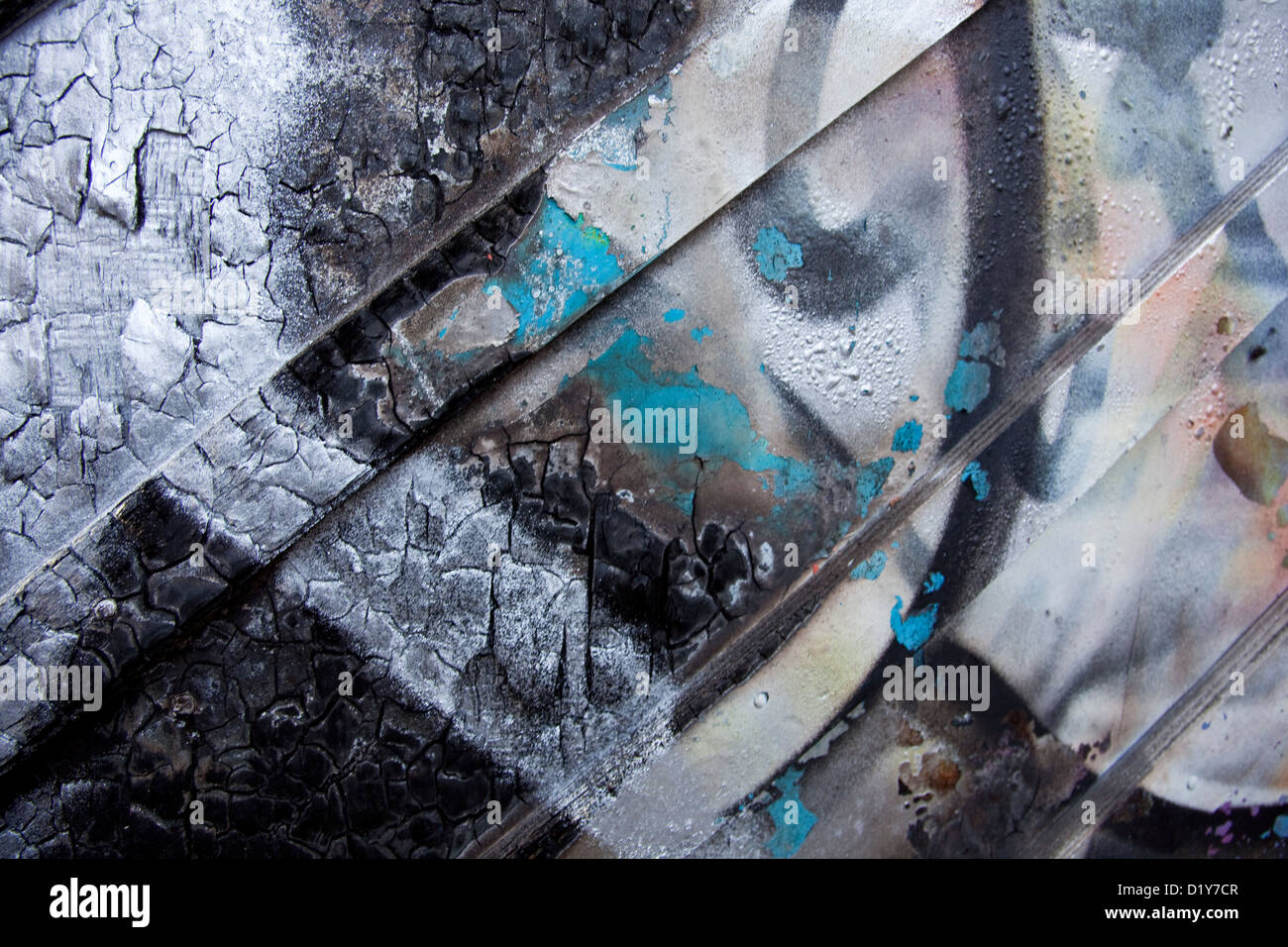 Burnt wooden panels with traces of graffiti paint Stock Photo - Alamy