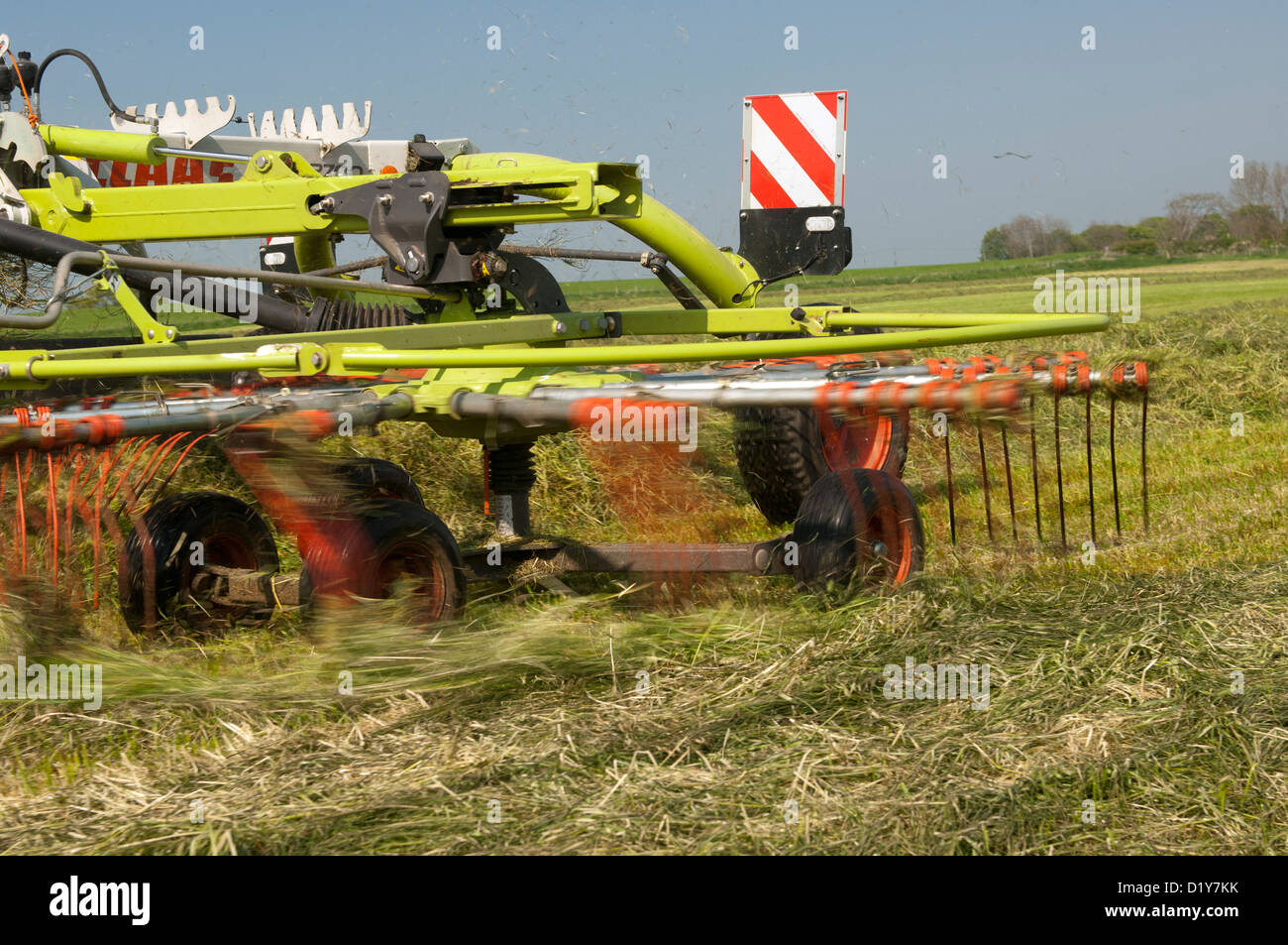 Close up of Claas grass rake at work in silage field. Northumberland ...
