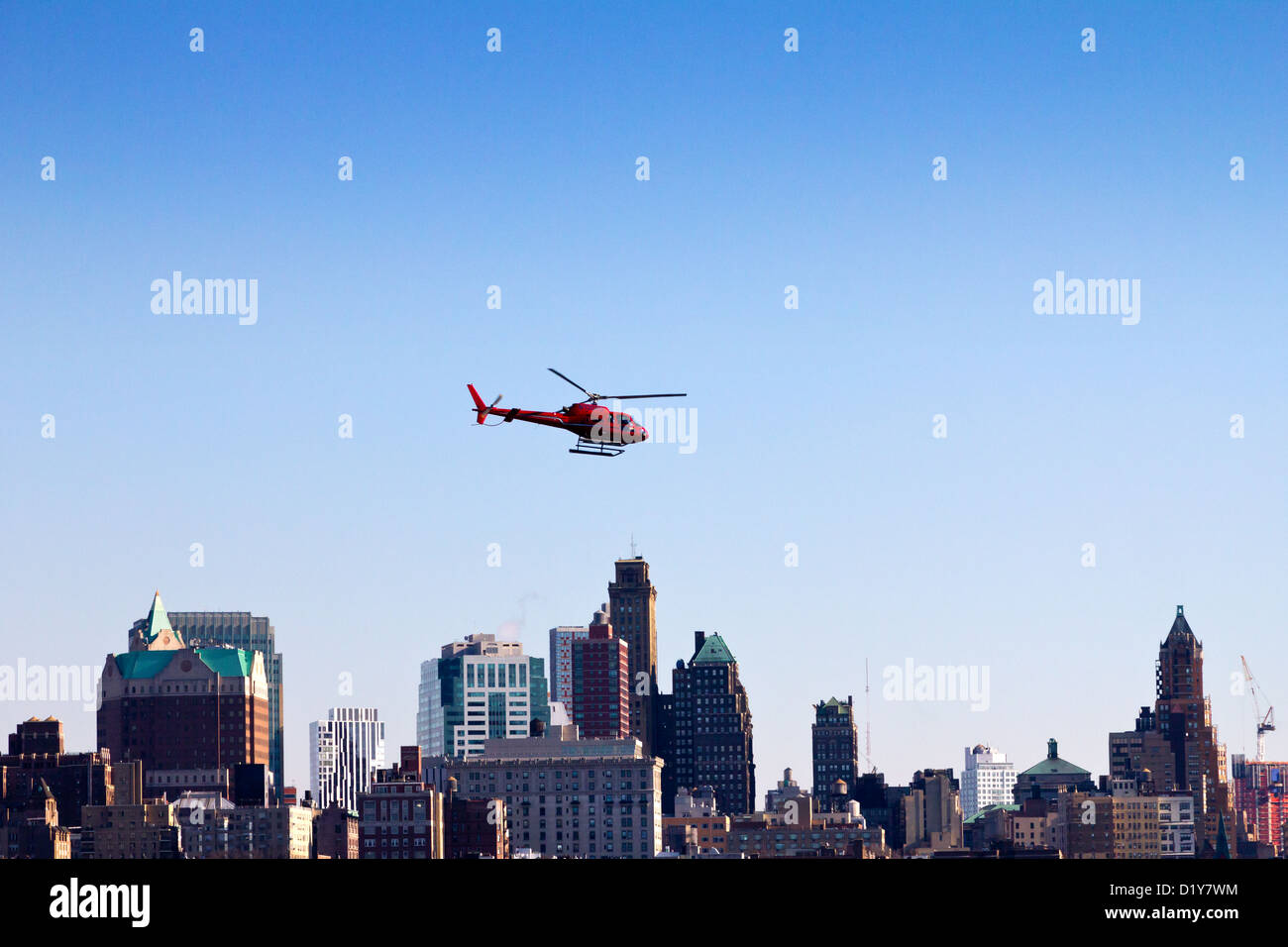 Helicopter flying over the Brooklyn skyline in New York City Stock ...