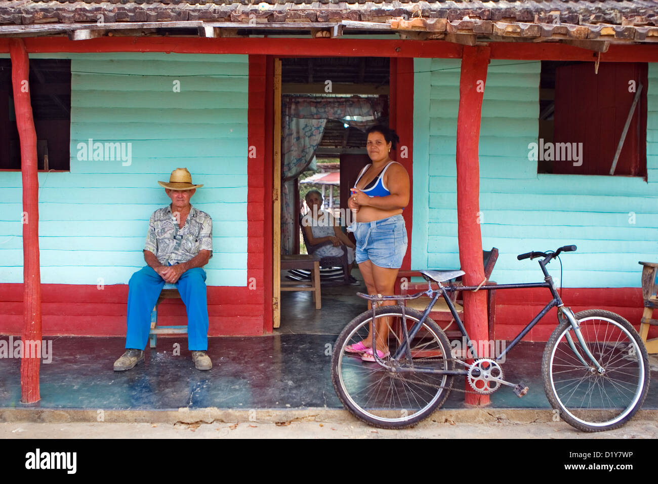 Cuban family posing in front of their house Stock Photo - Alamy