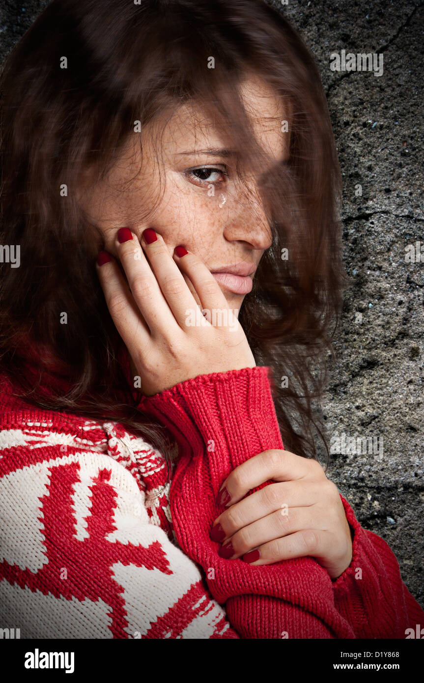 Sad woman crying, hair flying, dark background Stock Photo - Alamy