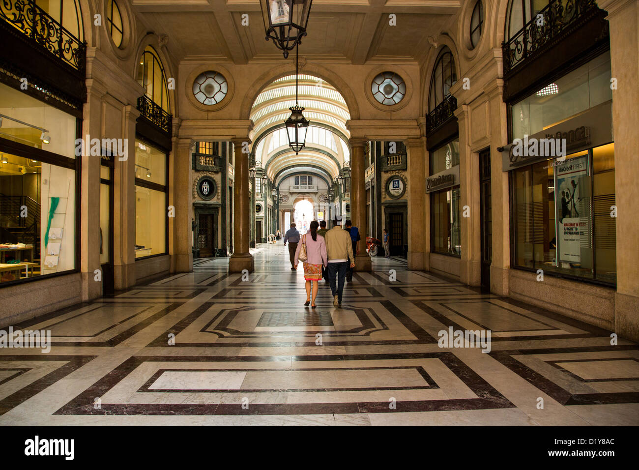 Arcade lined with small shops in Turin in Italy Stock Photo - Alamy