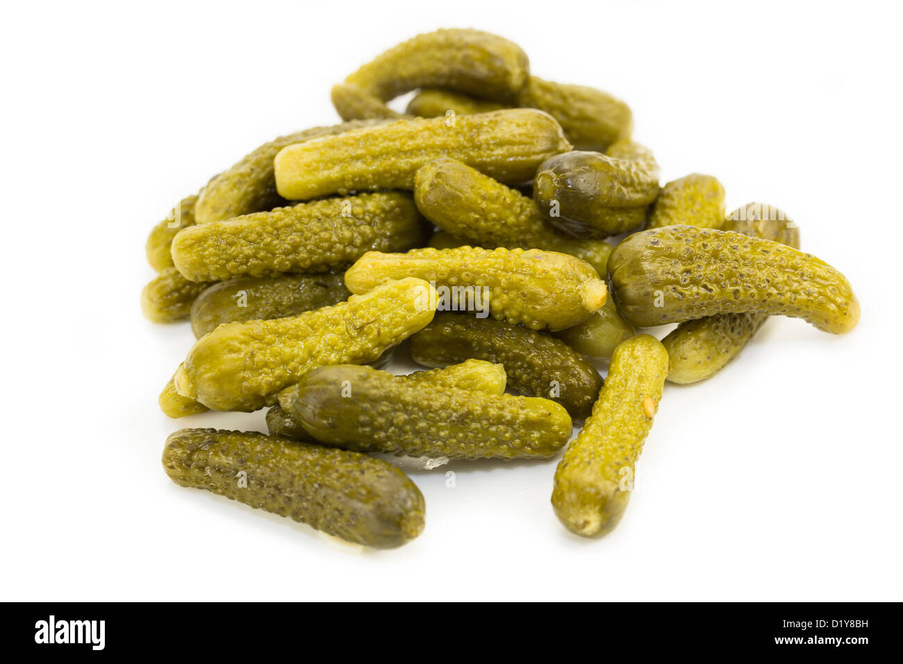 small pickled cucumbers on a white background Stock Photo - Alamy