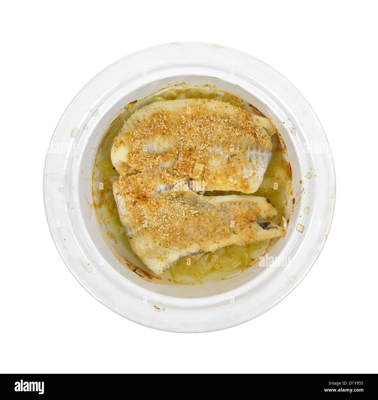 Two fillets of breaded haddock cooked with onions in a ceramic baking ...