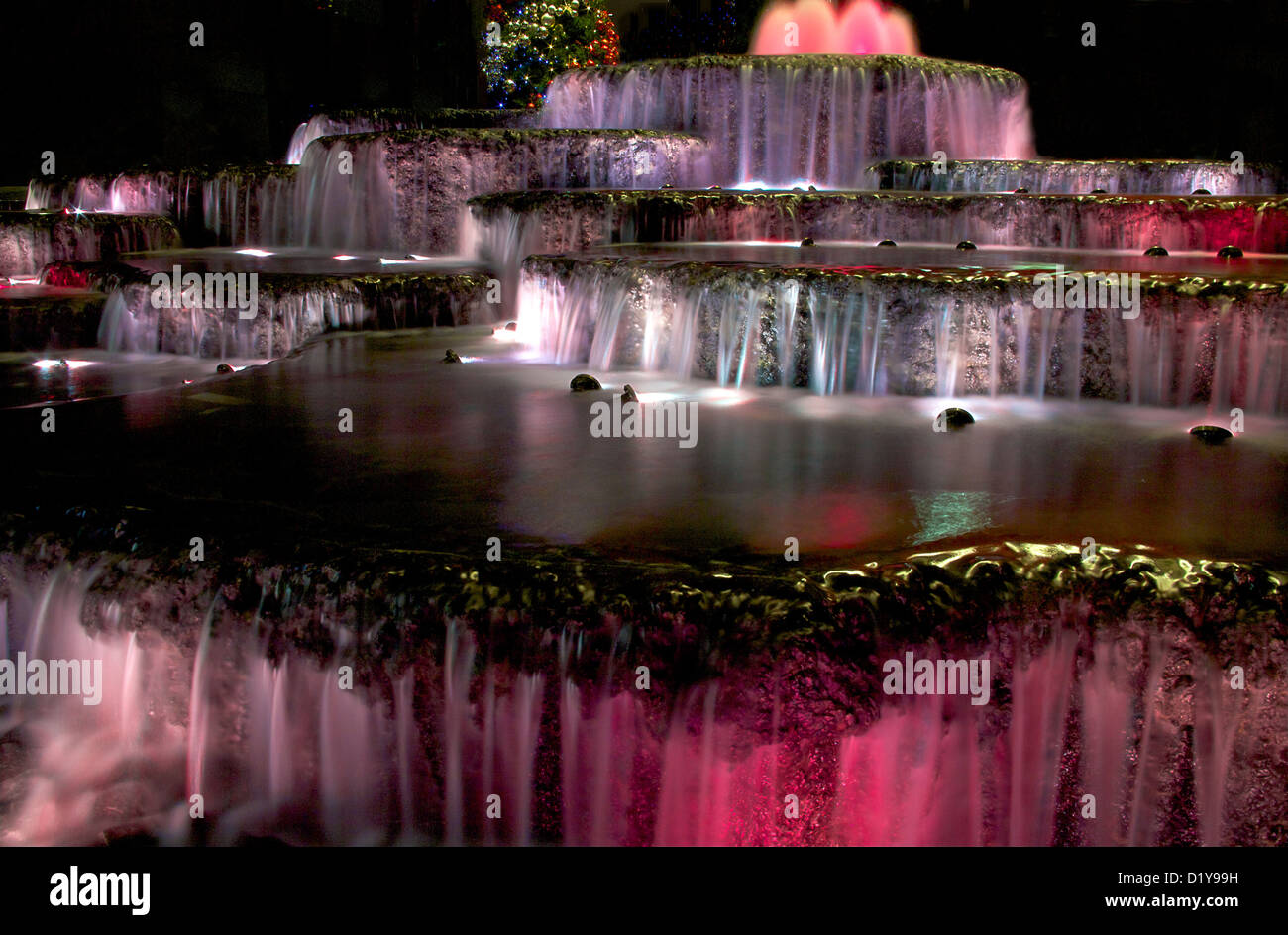 a pink water feature at night Stock Photo - Alamy