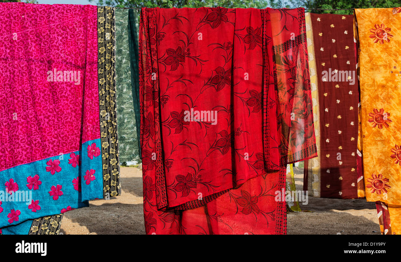 Colourful Indian saris hanging out to dry on a washing line. Andhra ...