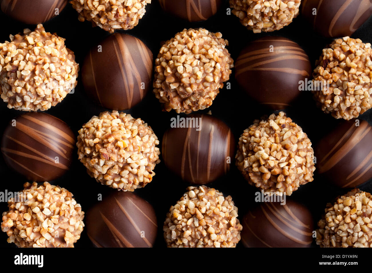 the sweet chocolate pralines background Stock Photo - Alamy