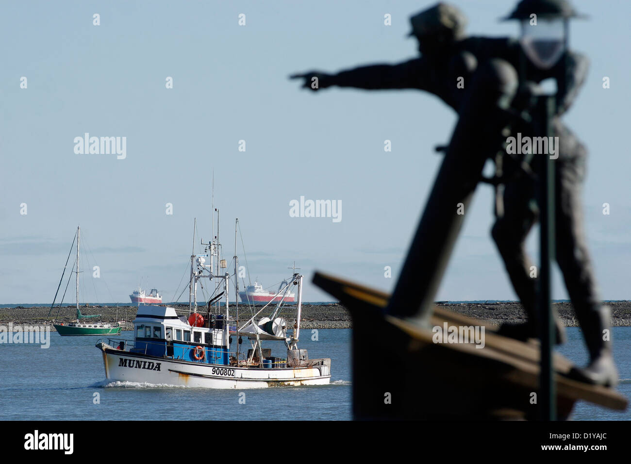 Trawler passing mariner sculpture, Nelson New Zealand Stock Photo - Alamy