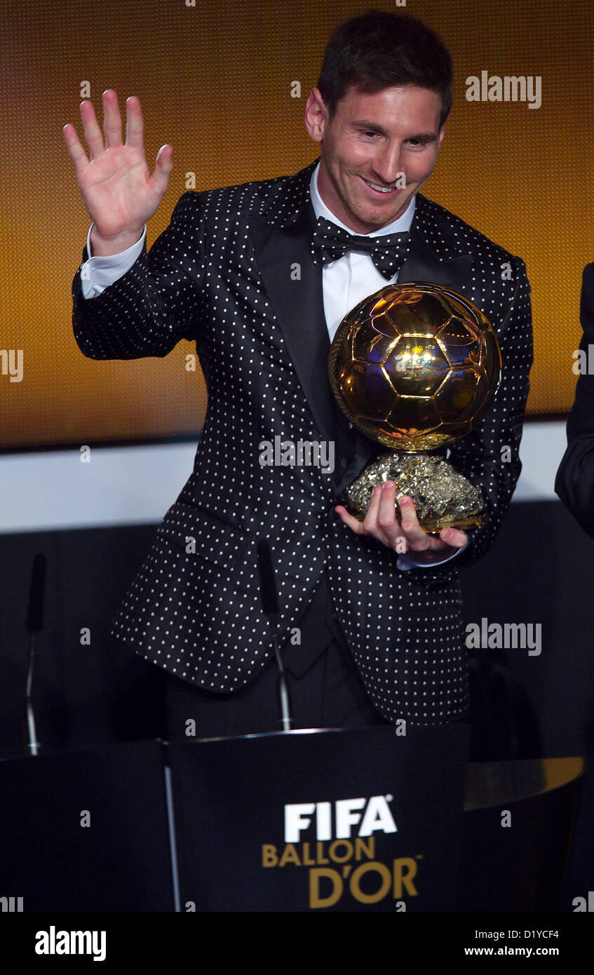 Lionel Messi of Argentina holds the trophy alloft after winning the ...