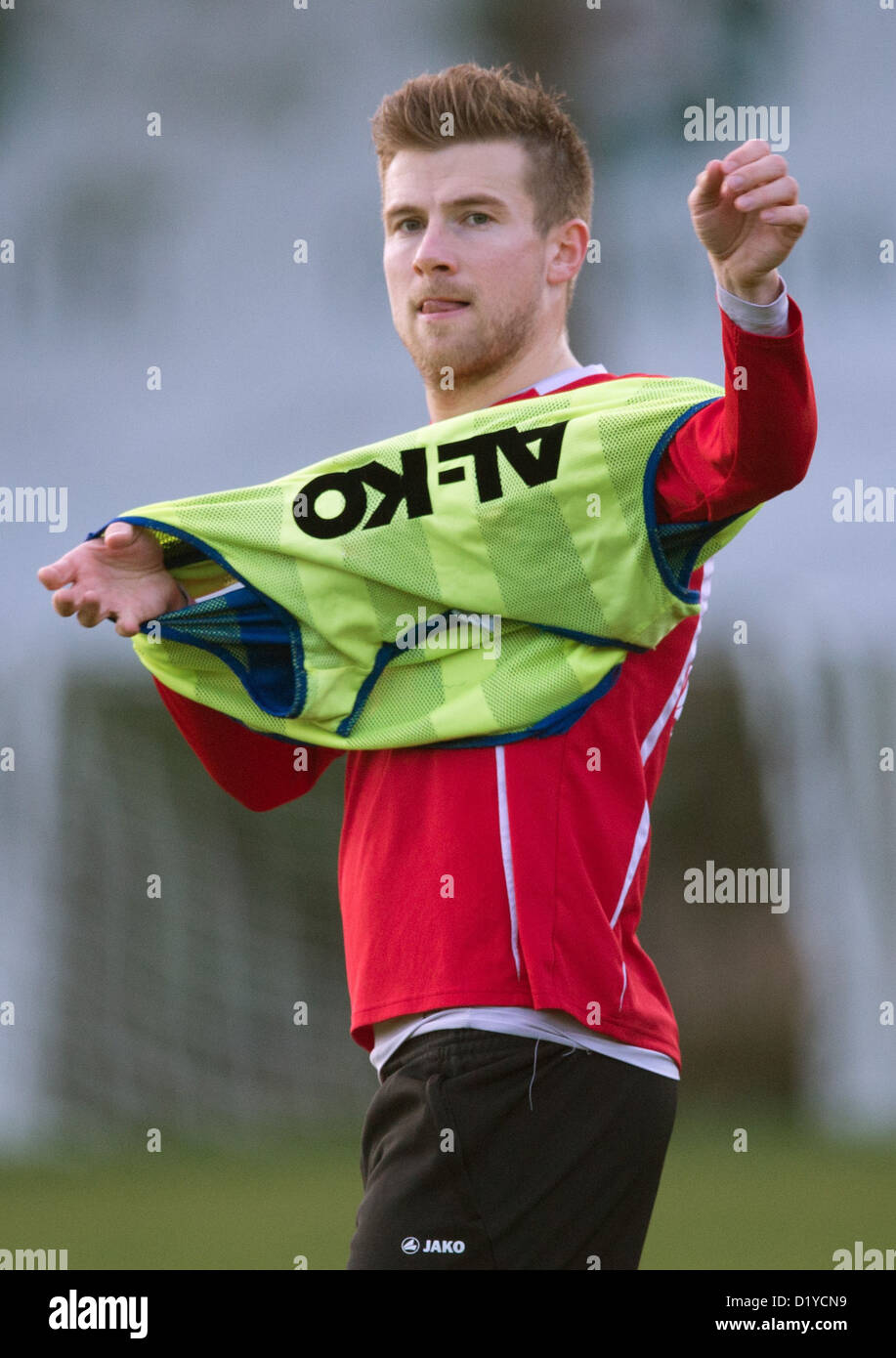 Augsburg's player Daniel Baier puts on a jersy during a practice ...
