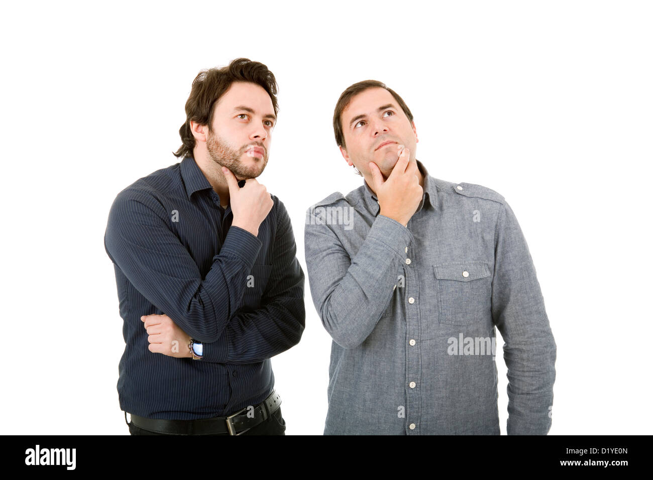 two young casual men thinking, isolated on white Stock Photo - Alamy