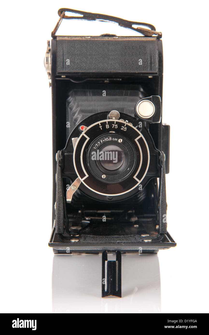 Old black photo camera isolated over white background Stock Photo - Alamy