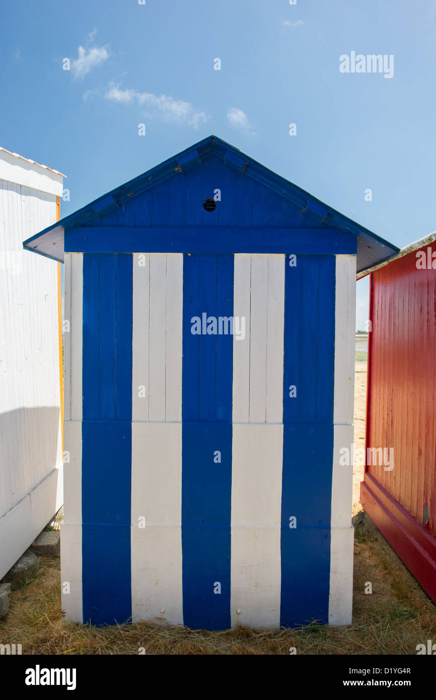 Blue white striped beach hut on the beach at Saint-Denis island d ...