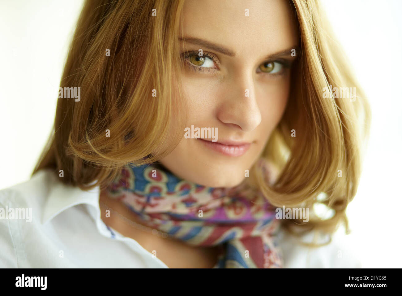 Face of young stylish woman looking at camera Stock Photo - Alamy