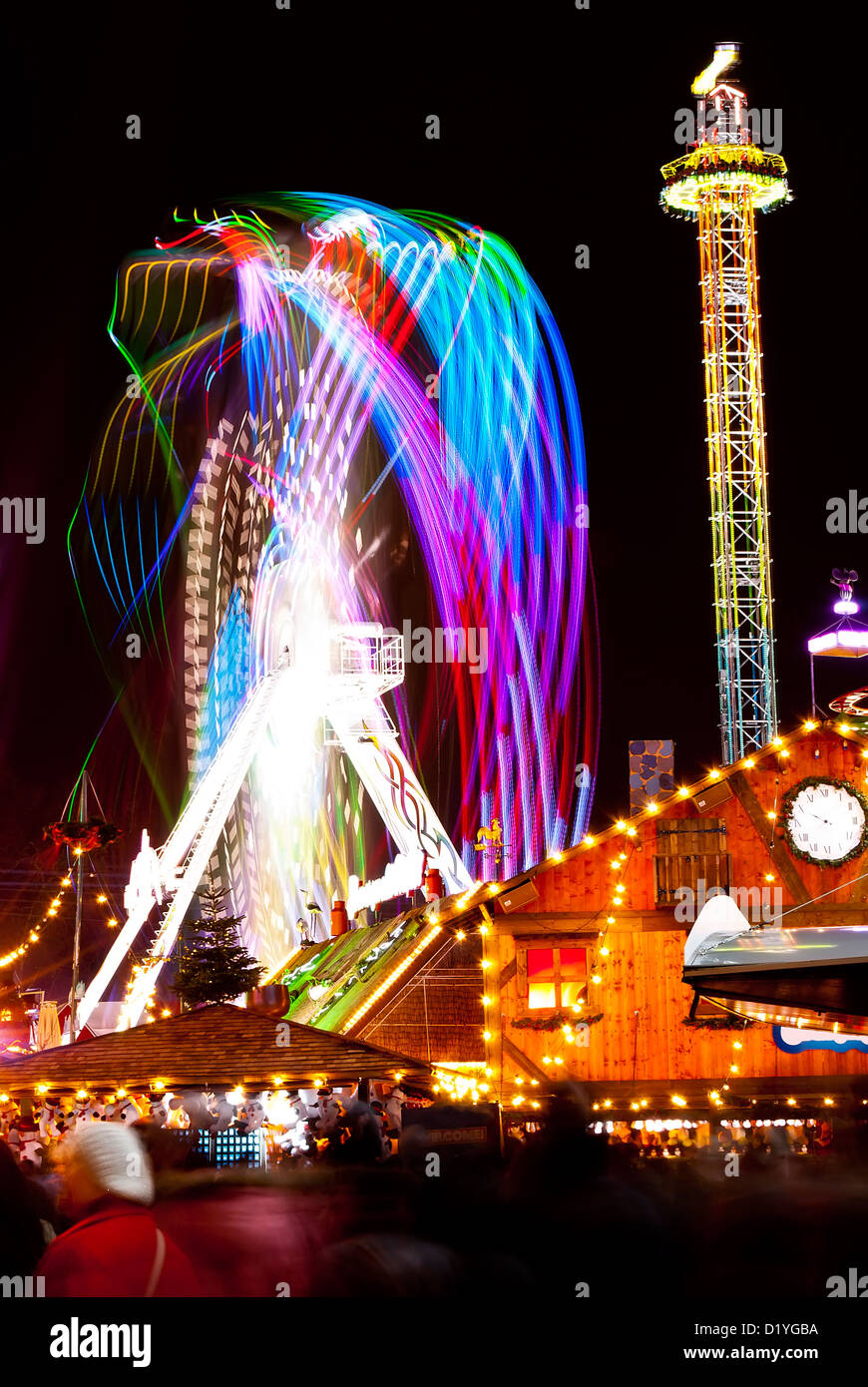long exposure pictures of amusement park rides and wheels at night ...