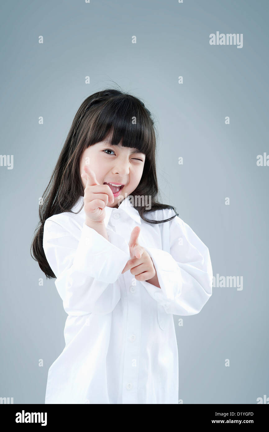 a girl posing while winking Stock Photo - Alamy