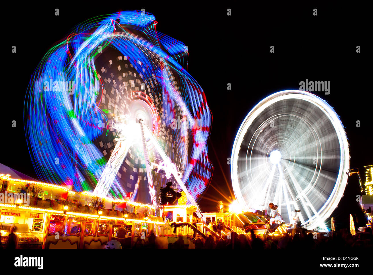 long exposure pictures of amusement park rides and wheels at night ...