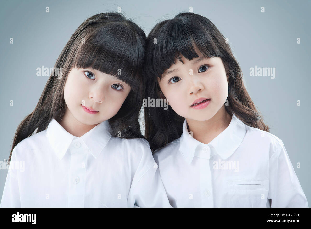 two female kids standing together Stock Photo - Alamy